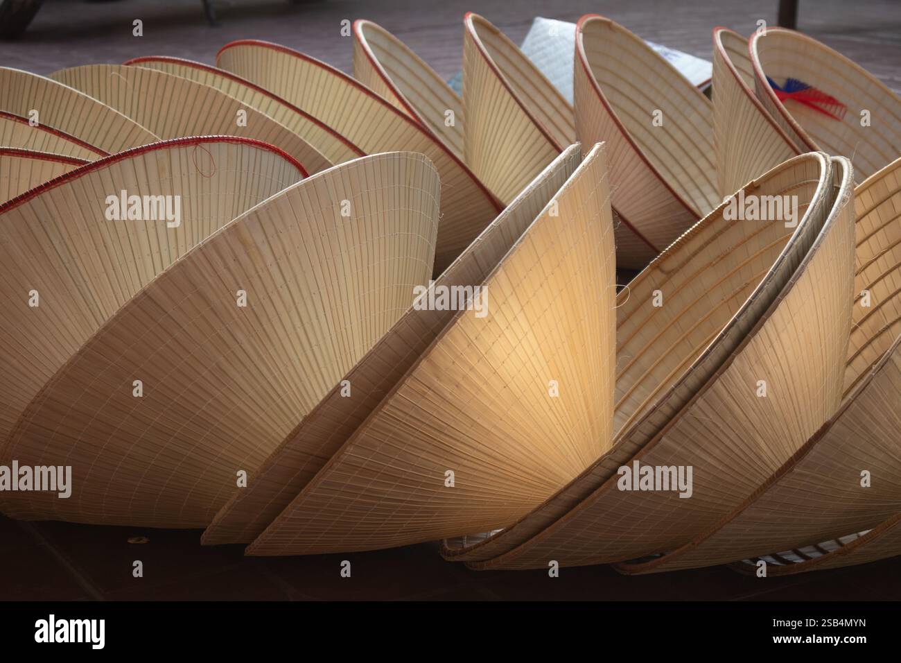 Traditional Vietnamese conical leaf hats for sale in market, warm ...