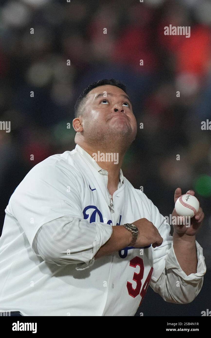 Fernando Valenzuela Jr. throws out the ceremonial first pitch before a ...