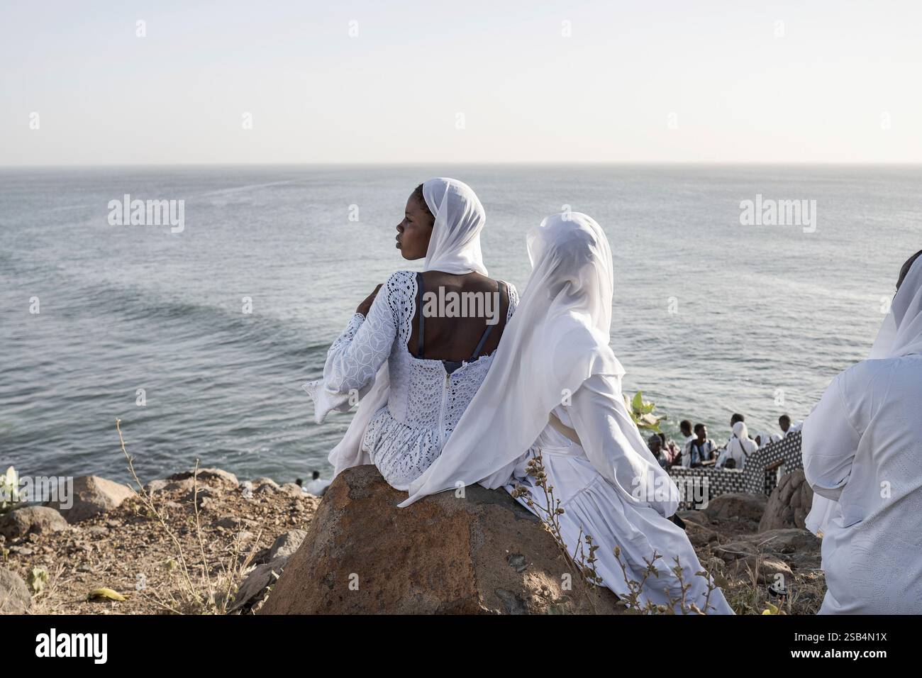 Dressed in white robes to symbolize purity and equality before God ...