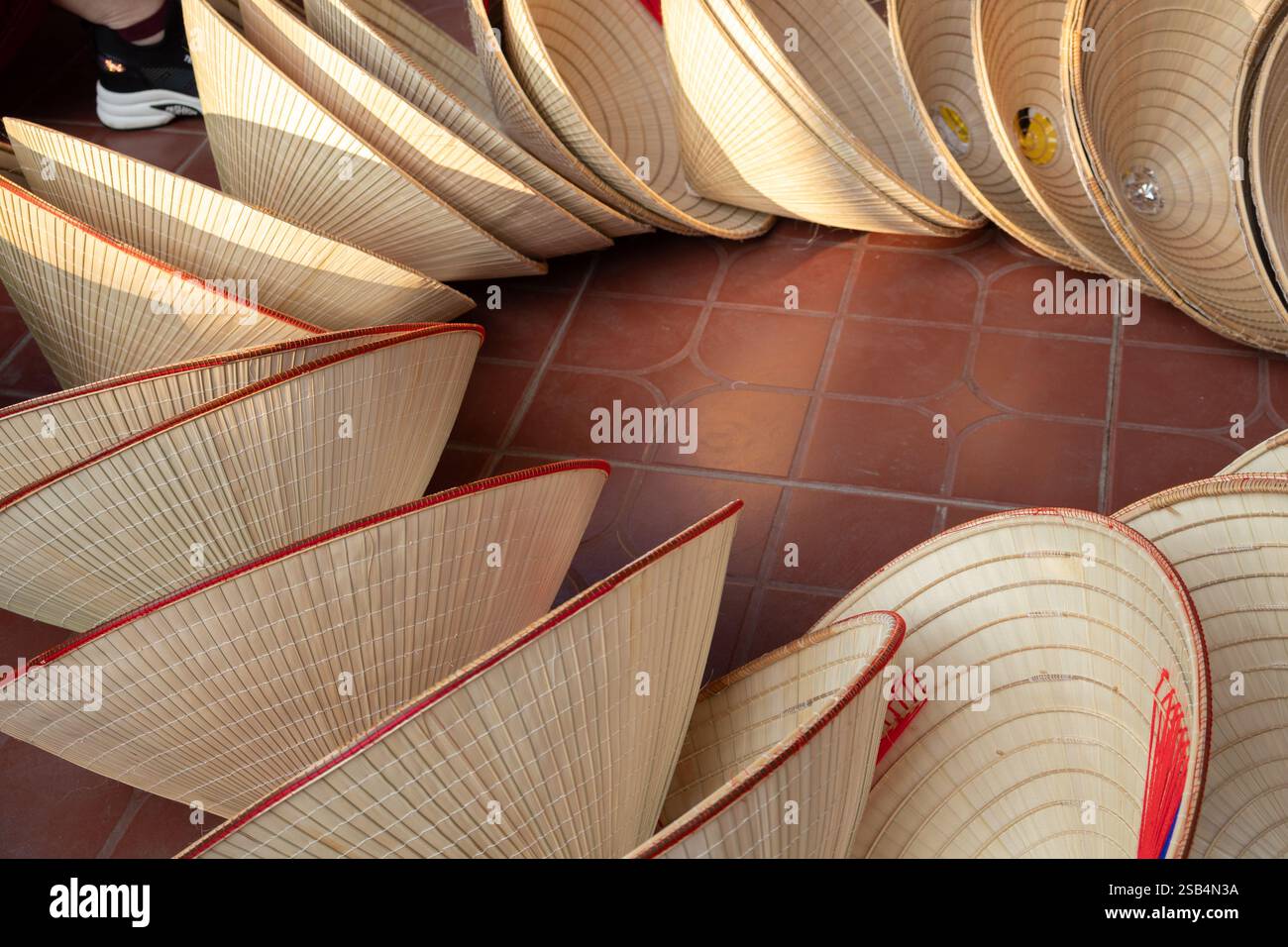 Traditional Vietnamese conical leaf hats for sale in market, warm ...