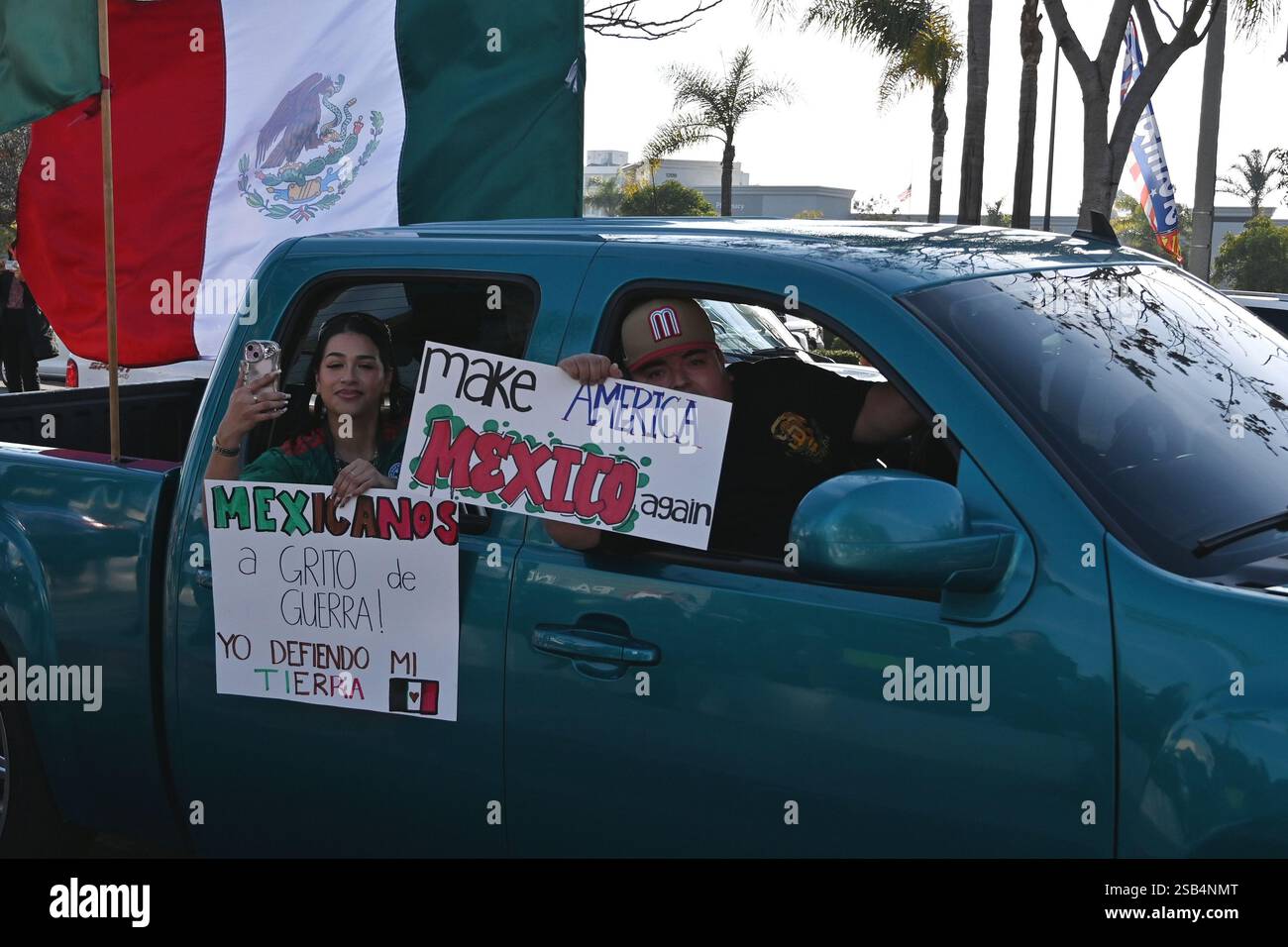 Protestors carried sign that reads “we will defend our land” and “Make ...