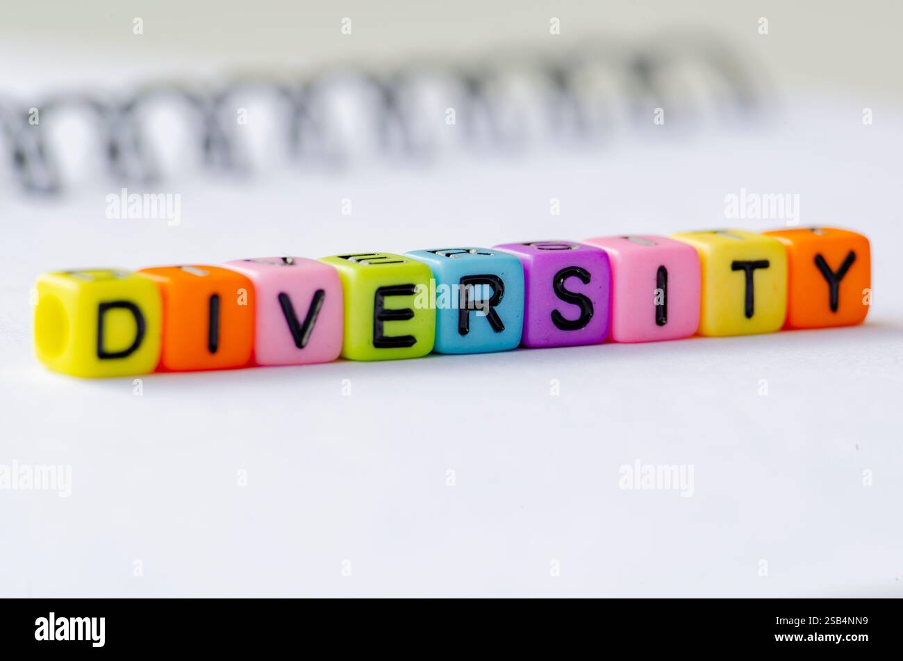 Diversity text on colorful plastic alphabet beads representing Business ...