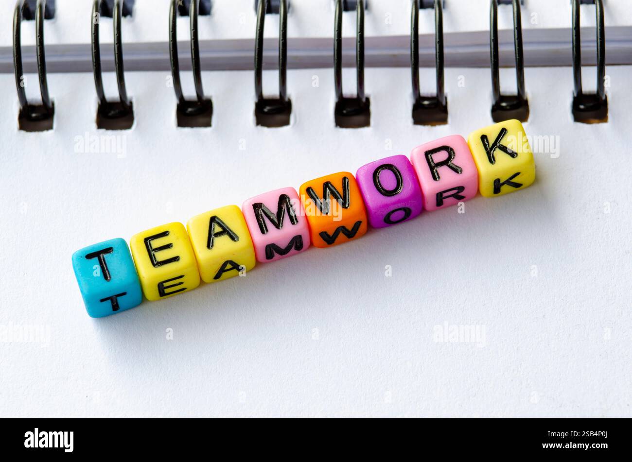 Top view of TEAMWORK text on colorful plastic alphabet beads. Business ...