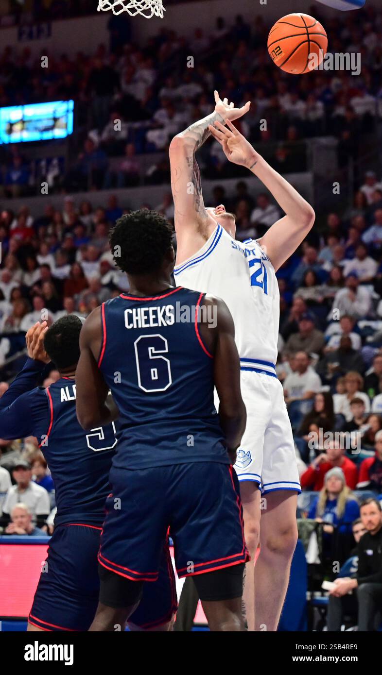 ST. LOUIS, MO - JANUARY 31 - Saint Louis center Robbie Avila (21) loses ...