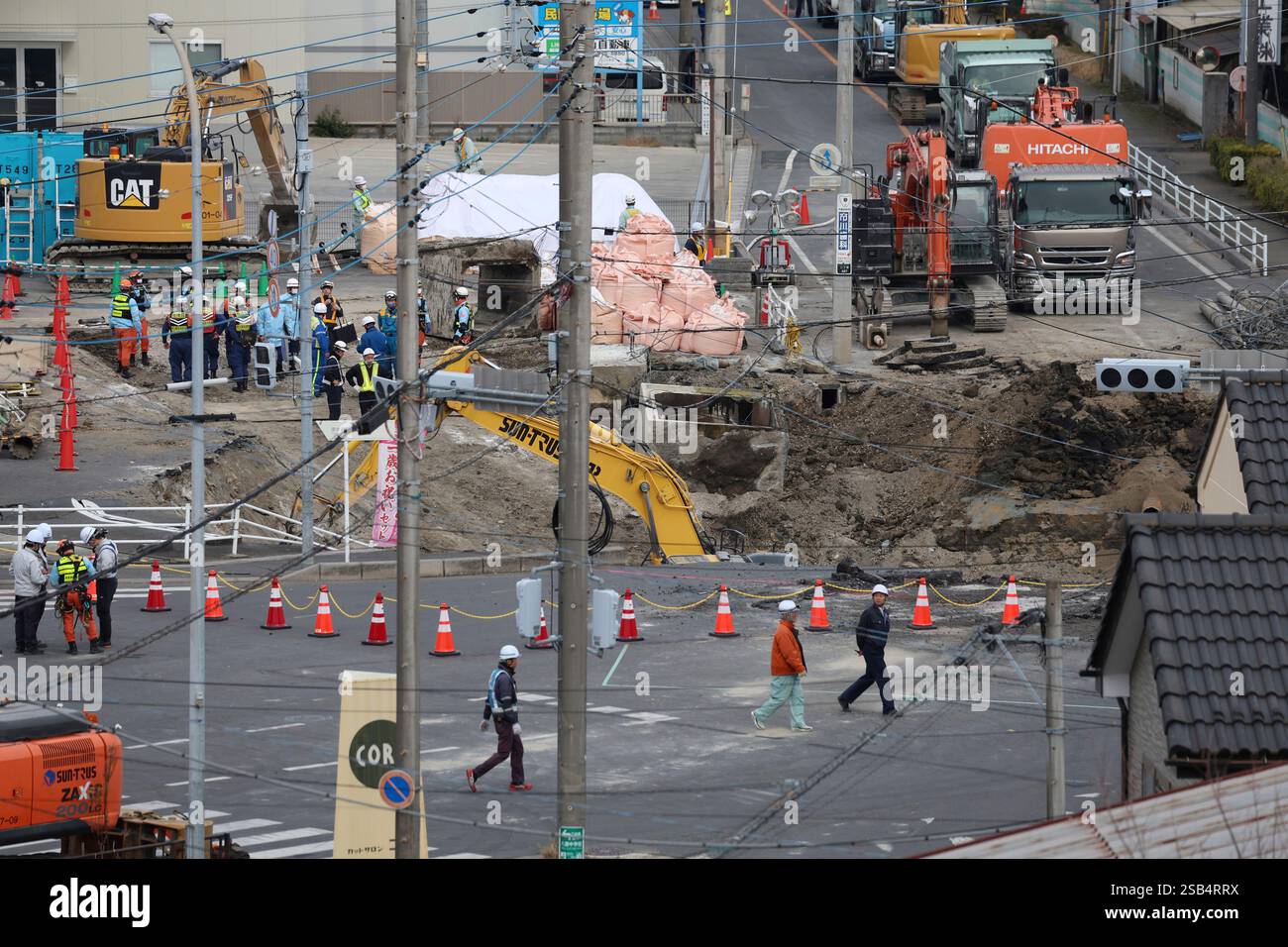 A photo shows the site of a road collapsed above huge sinkholes at an ...