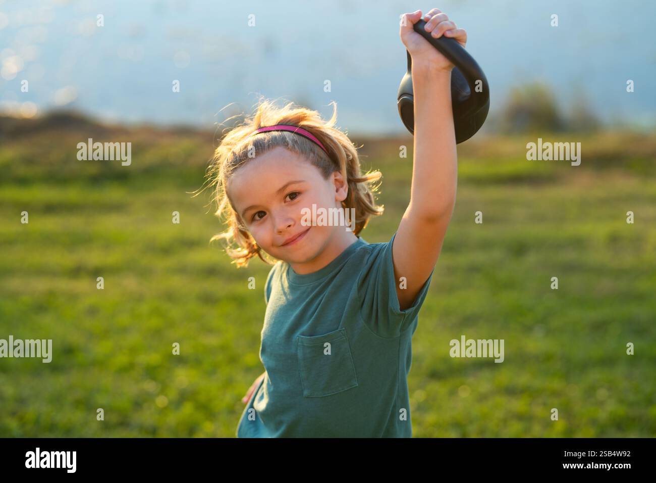 Kid boy working out with dumbbells. Sport and kids training. Child ...