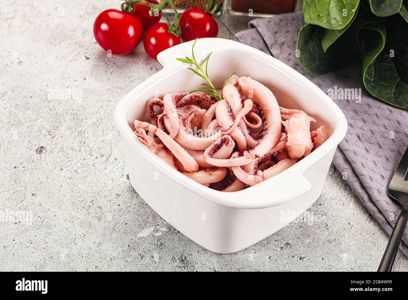 Marinated squid tentacles in the bowl for snack or salad Stock Photo ...