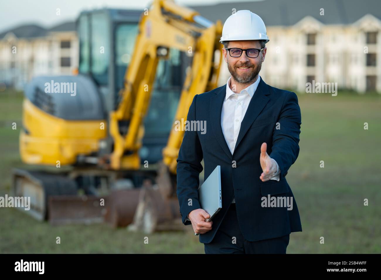 Construction business owner. Man in suit and hardhat halmet at building ...