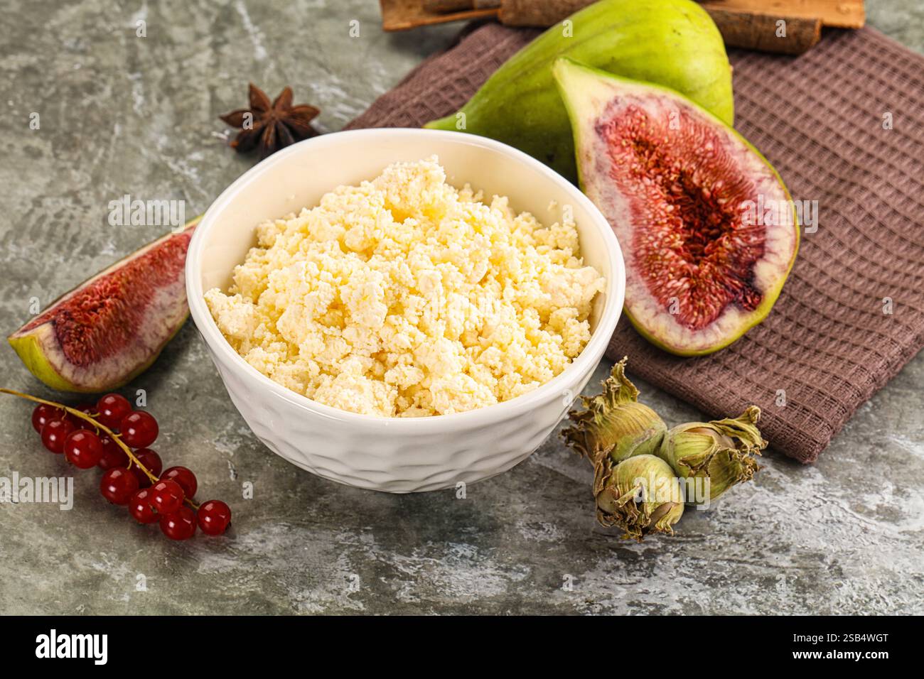 Delicous sheep cottage cheese curd served fig Stock Photo - Alamy