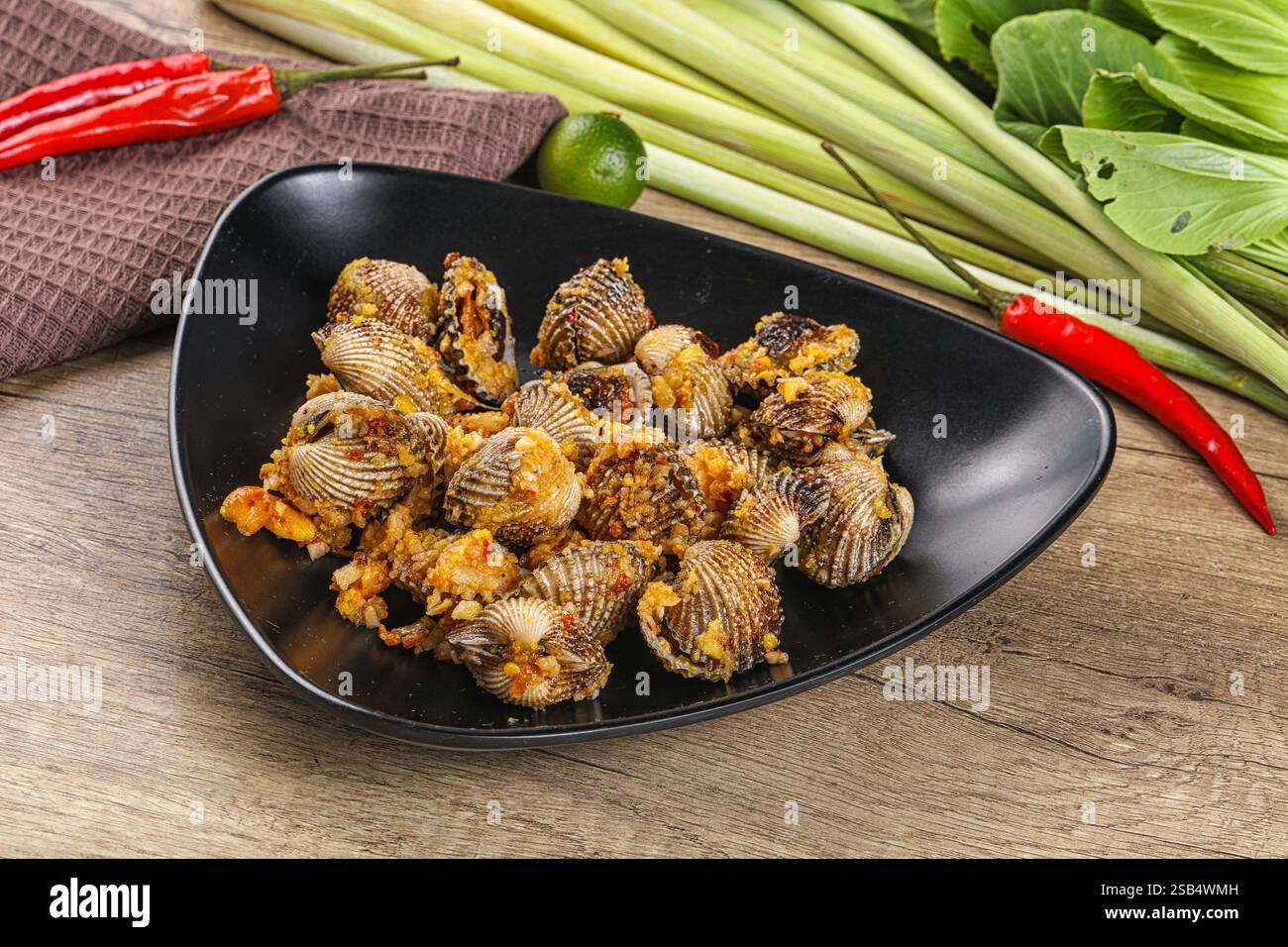 Blood Cockle Fried With Garlic and spices Stock Photo - Alamy