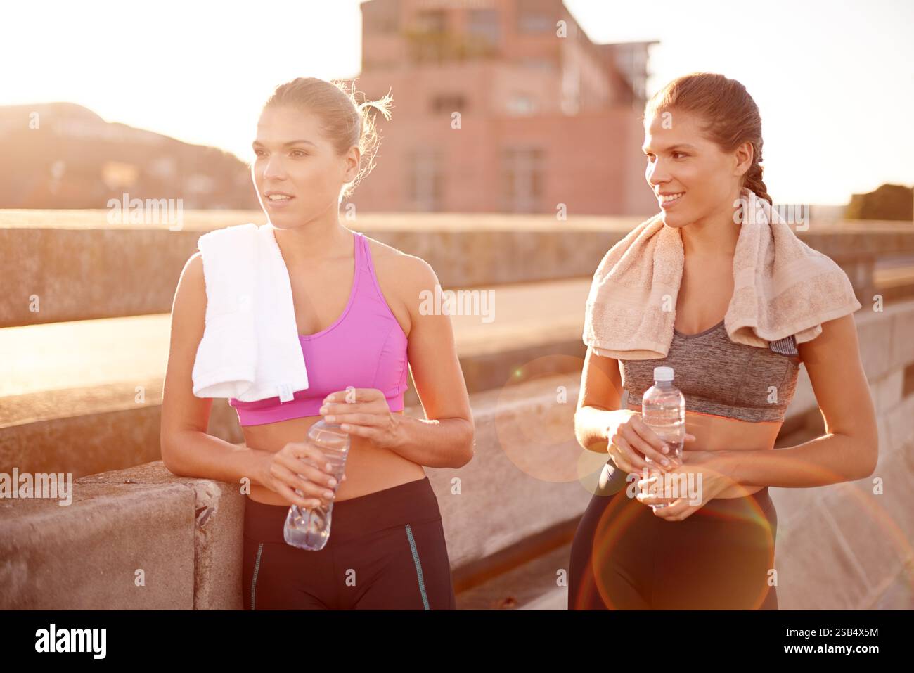 Workout, city and women on road with smile for marathon exercise ...