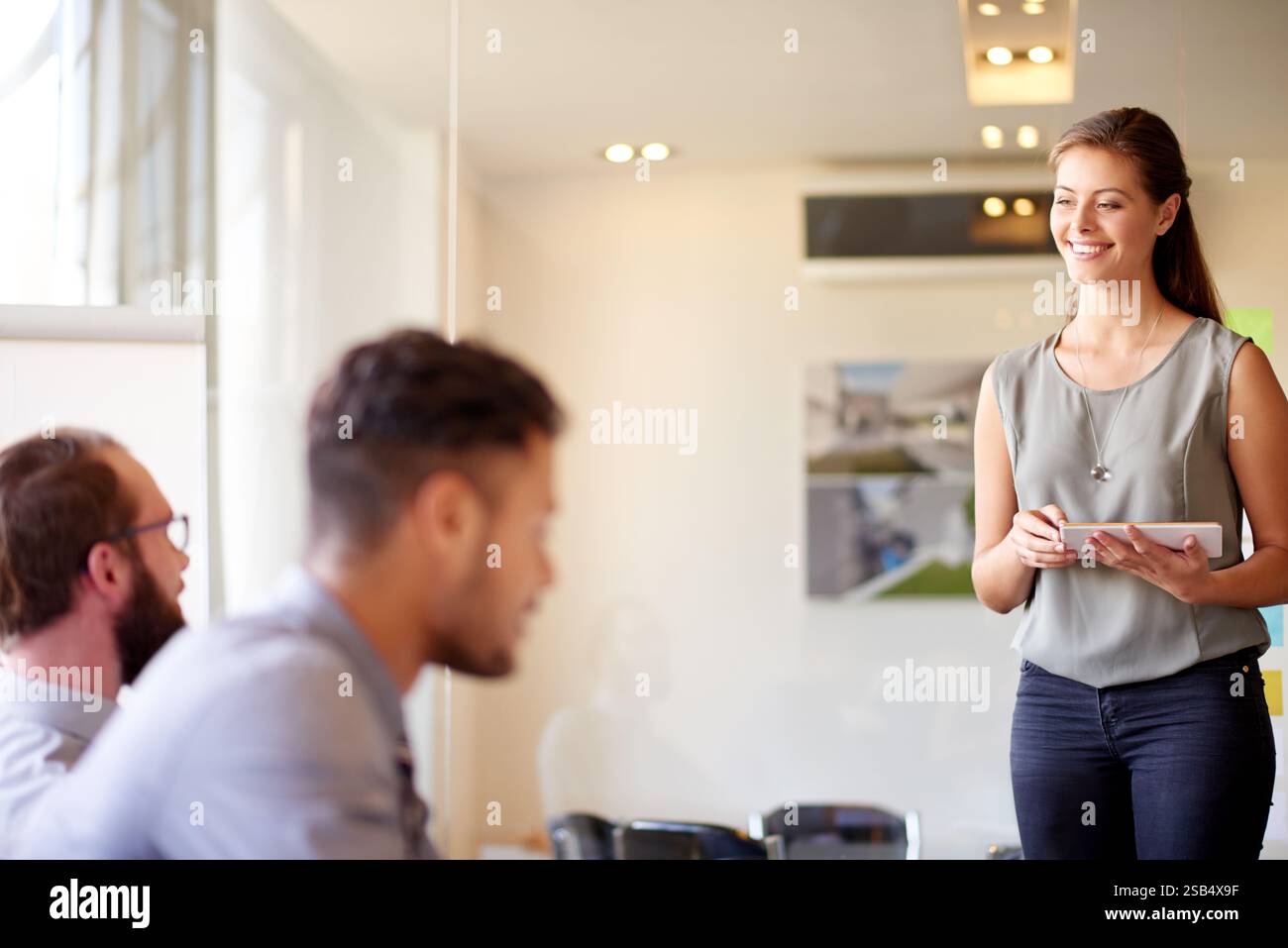 Architecture, presentation and tablet with woman in meeting for client ...