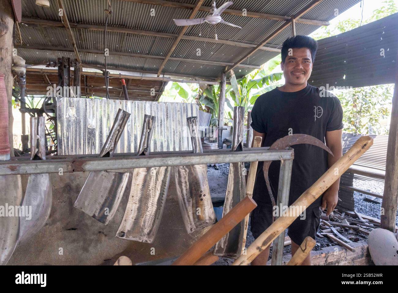 A Blacksmith at Dan Run in Soutr Nikom in Cambodia Stock Photo - Alamy