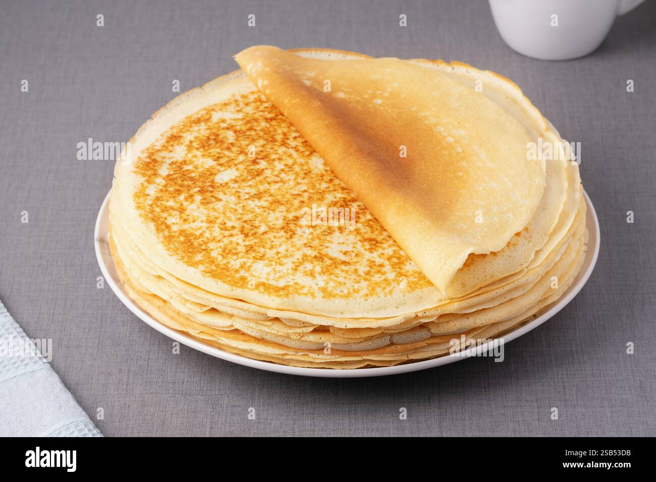 Stack of traditional russian pancakes blini on gray background ...
