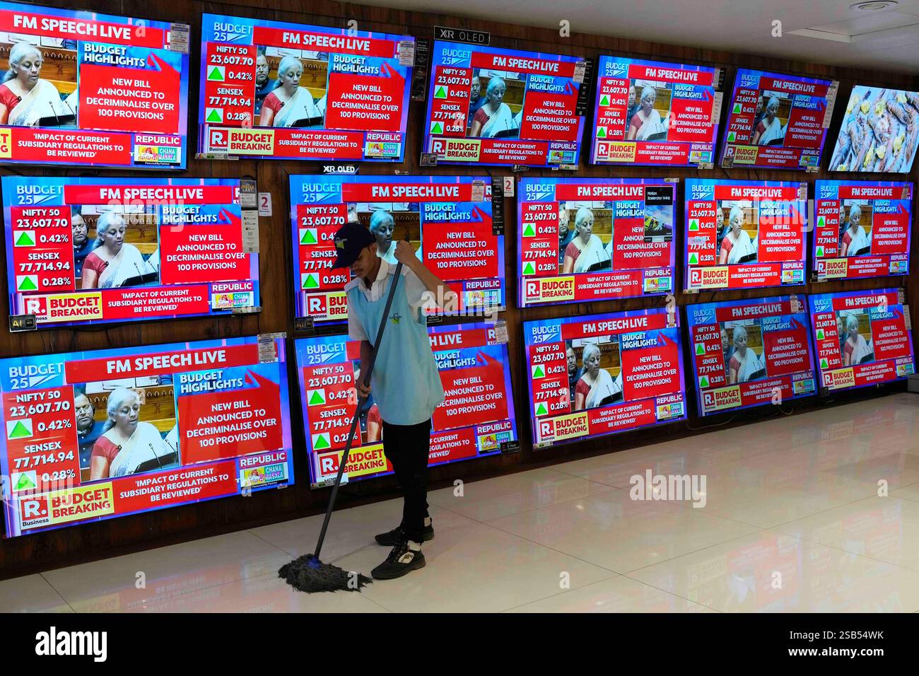 Finance Minister Nirmala Sitharaman is seen on television screens ...