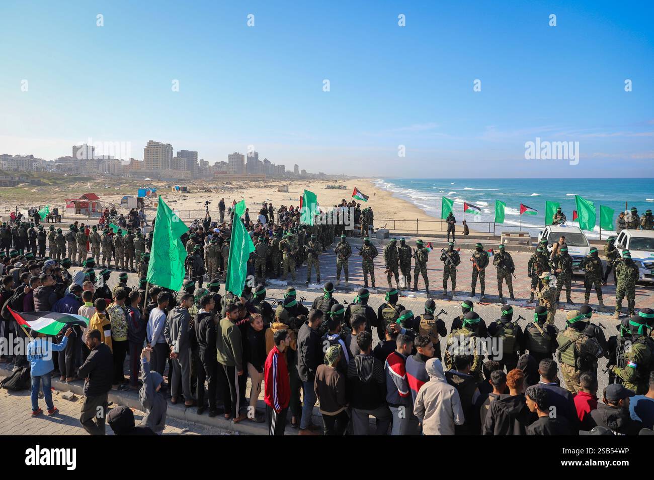 Hamas fighters deploy at the site of the hand over of American-Israeli ...