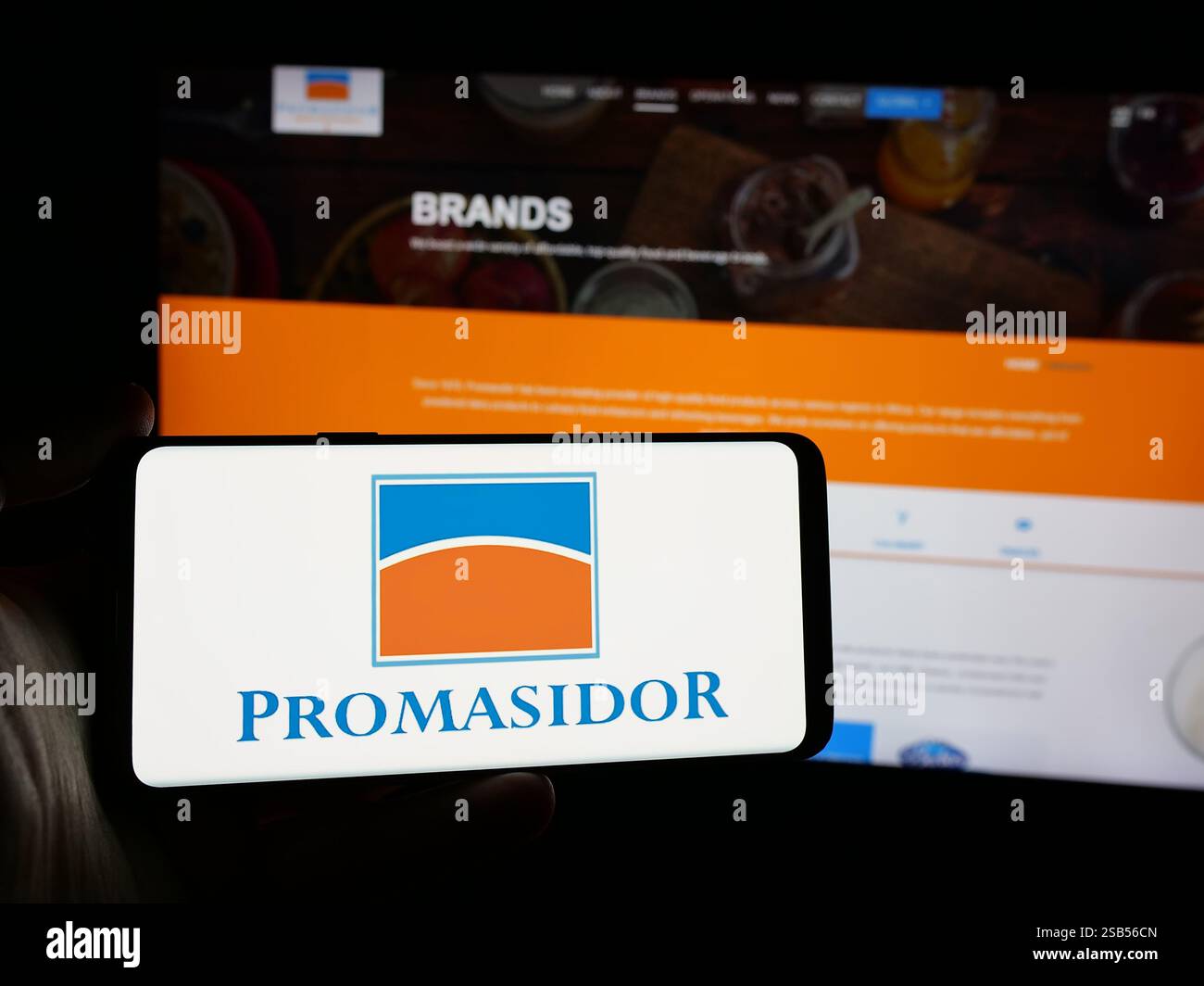 In this photo illustration, a person is holding a smartphone with the ...