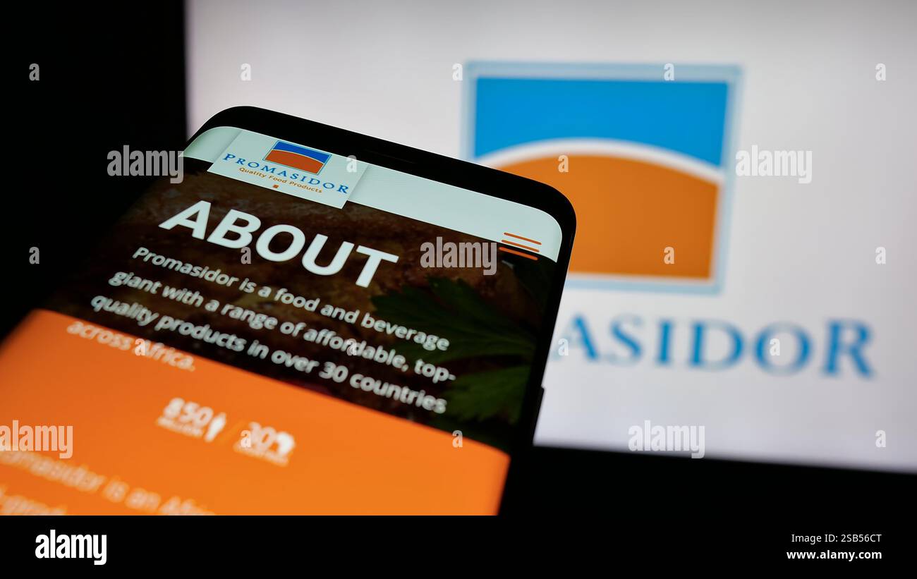 In this photo illustration, a smartphone with the website of consumer ...