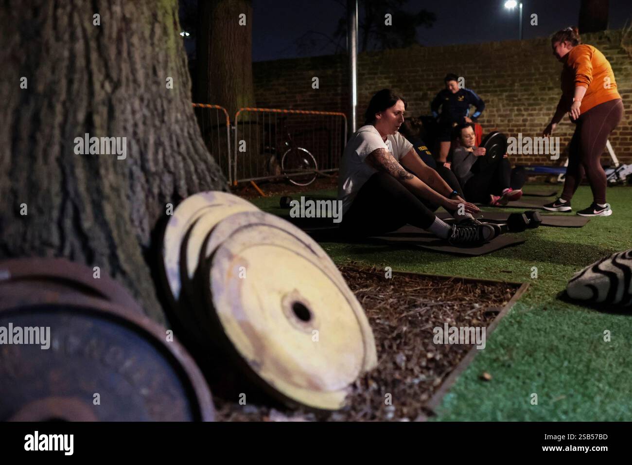 Chloe Spriggs, left, takes a moment as members of Teddington women's ...