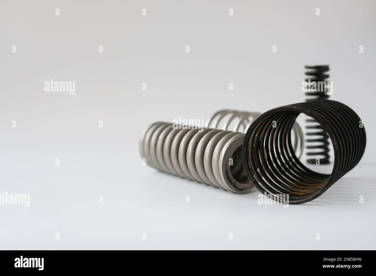 Set metal springs of different metals. Spare parts of the engineering ...