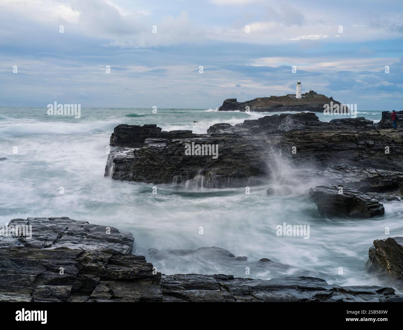 GODREVY ROCKS AND ROUGH SEA WAVES BREAKING OVER ROCKS Stock Photo - Alamy