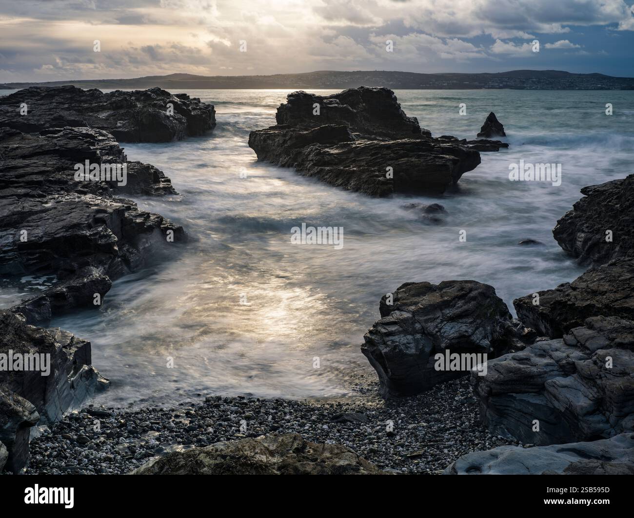 GODREVY ROCKS AND ROUGH SEA WAVES BREAKING OVER ROCKS Stock Photo - Alamy
