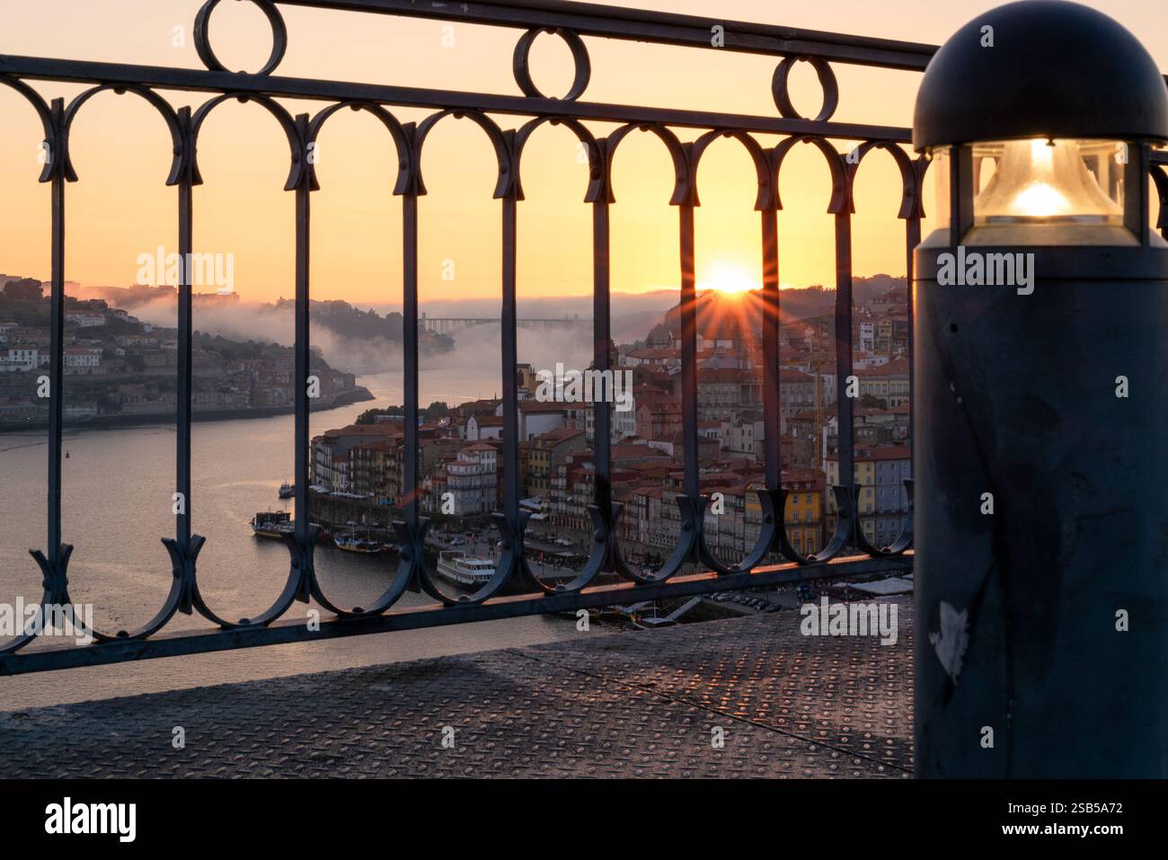 Classic view of Porto at sunset from Dom Luis I bridge with Douro river ...