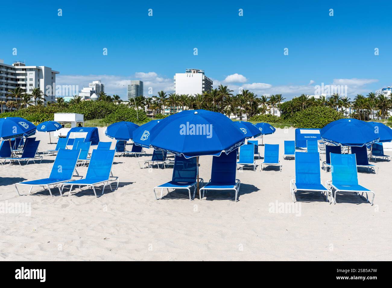 Miami, FL, USA - March 30, 2024: Miami Beach has sun loungers and ...