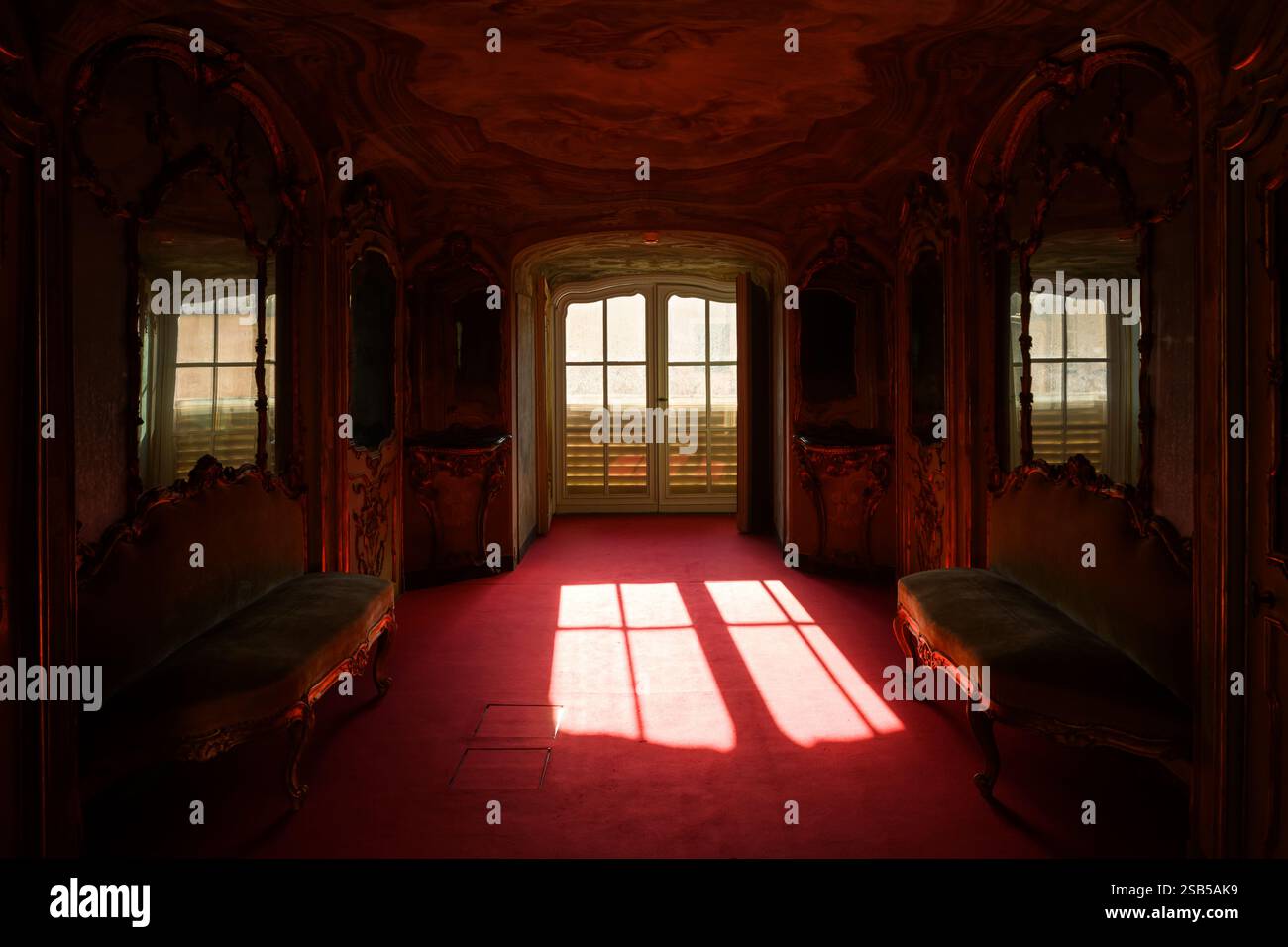 Bright light glowing from vintage windows on historical interior with ...