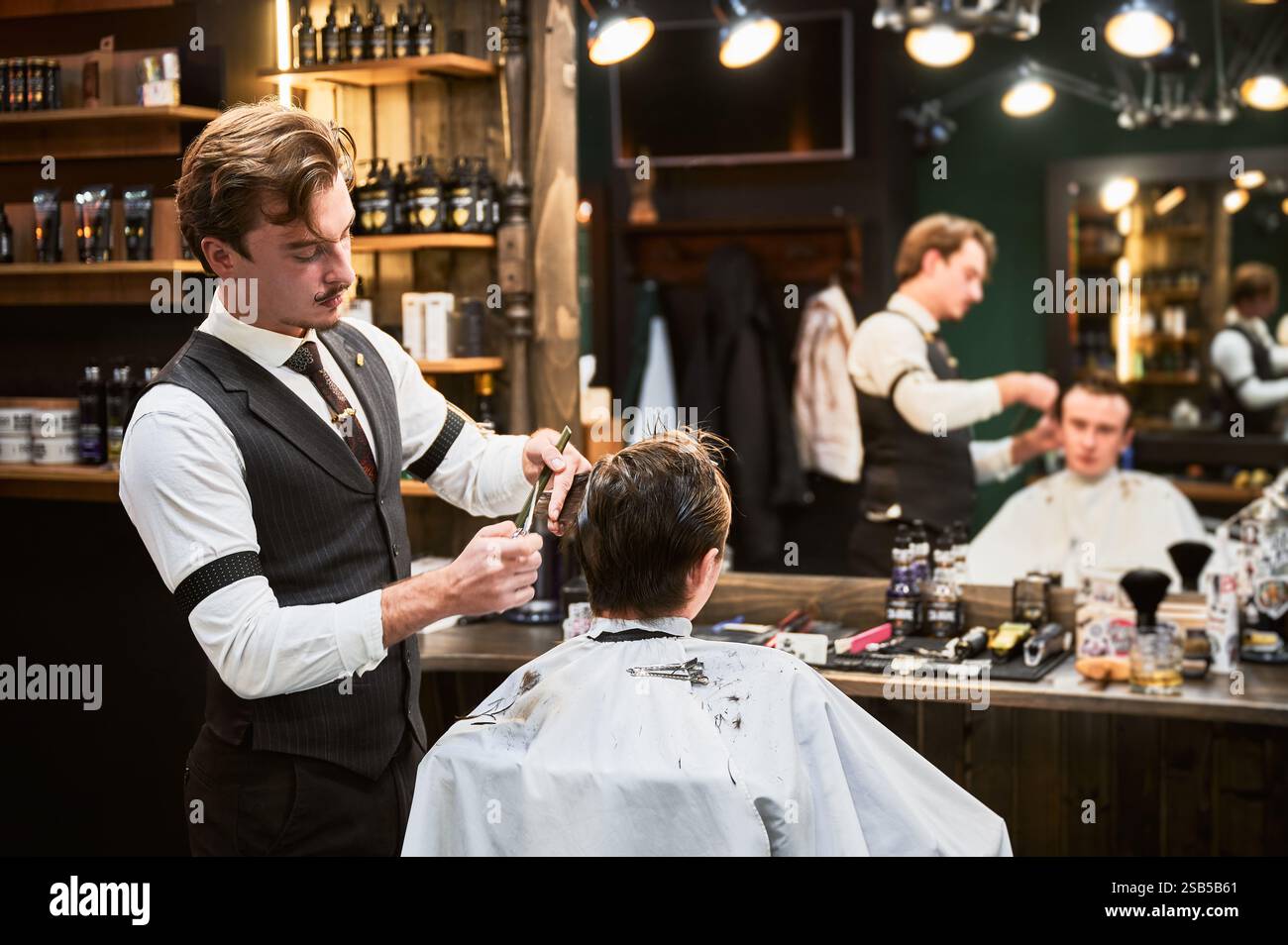 Cropped photo of handsome hairdresser in fancy outfit cutting wet hair ...