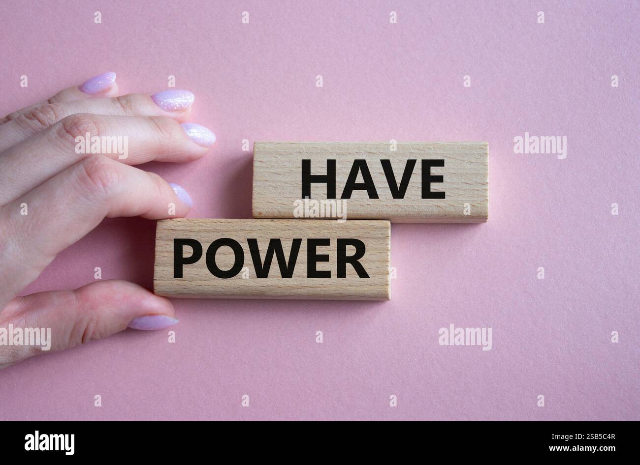 Have power symbol. Wooden blocks with words have power. Businessman ...