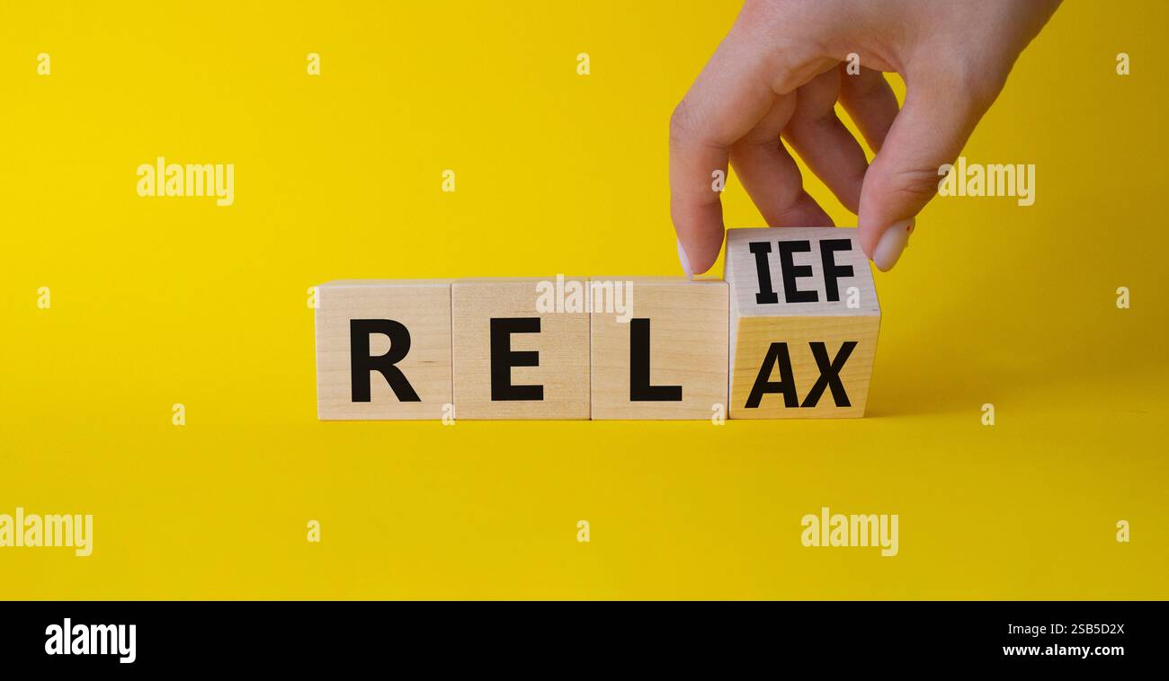 Relief and relax symbol. Hand turns cubes and changes the word Relief ...