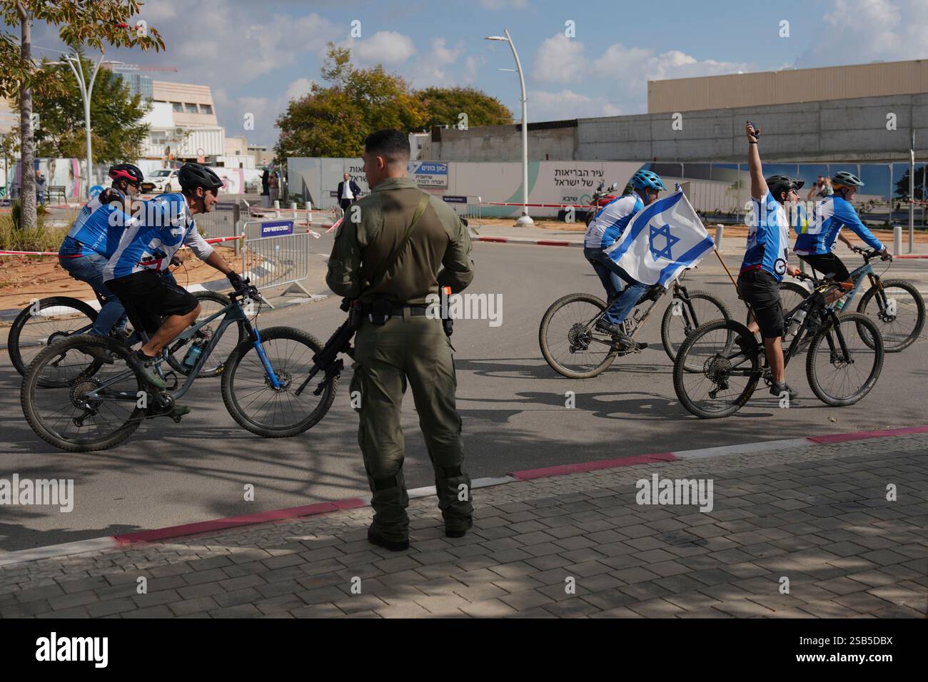 Cycling friends of Ofer Kalderon celebrate his release as part of a ...