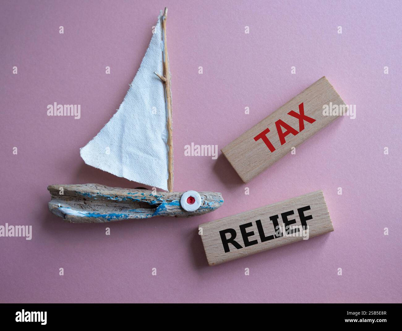 Tax Relief symbol. Concept word Tax Relief on wooden blocks. Beautiful ...