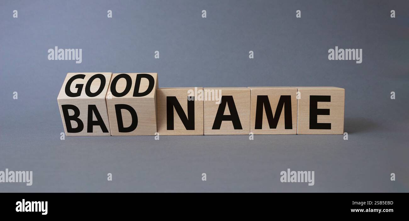 Good name and bad name symbol. Turned wooden cubes with words Bad name ...