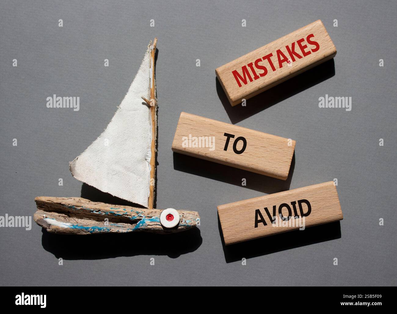 Mistakes to Avoid symbol. Wooden blocks with words Mistakes to Avoid ...