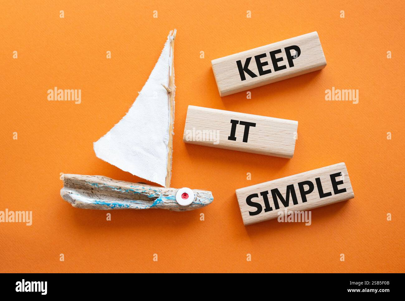 Keep it Simple symbol. Concept words Keep it Simple on wooden blocks ...