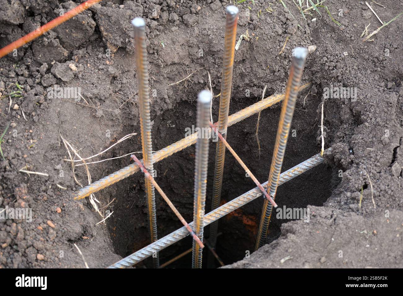 Rebar installed in the hole in the ground for the foundation of ...