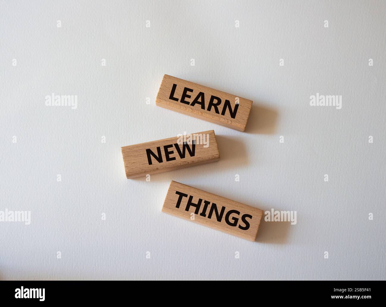 Learn new things symbol. Concept words Learn new things on wooden ...