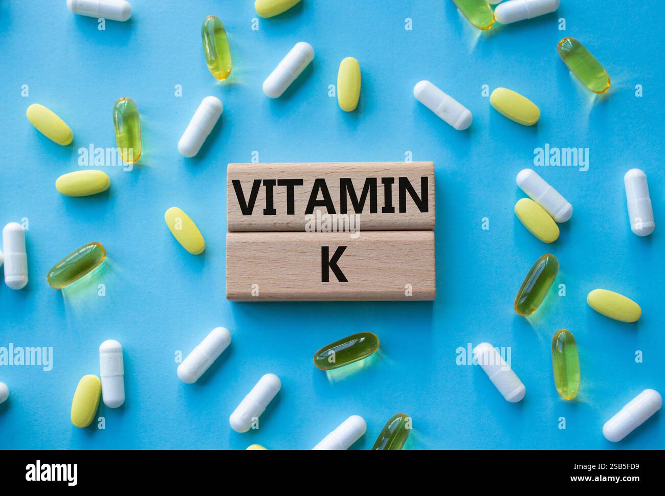 Vitamin K symbol. Concept word Vitamin K on wooden blocks. Beautiful ...