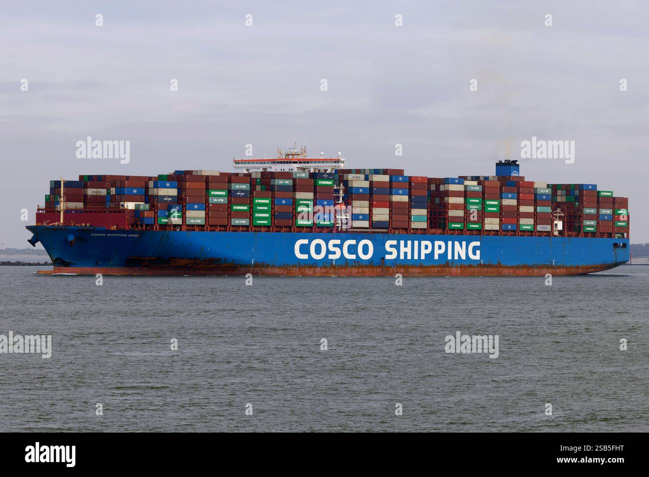 The container ship COSCO Shipping Aries leaves the port of Rotterdam on ...