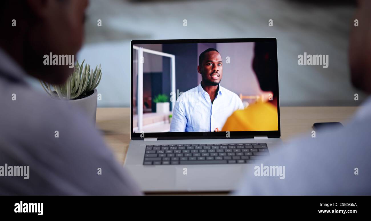 Couple Watching Television Show On Laptop Computer Stock Photo - Alamy