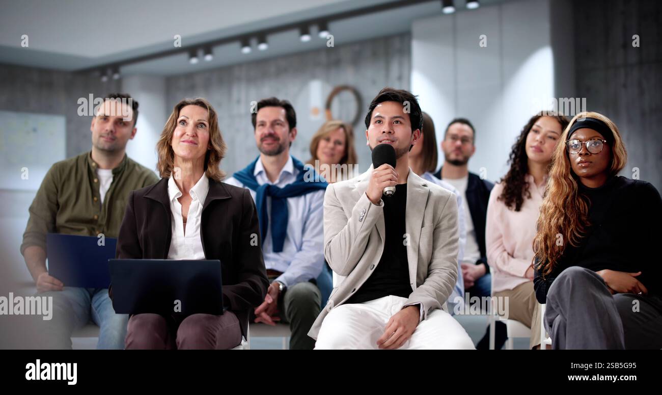 Man Engaging in Learning Activities at Diverse Business Seminar Event ...