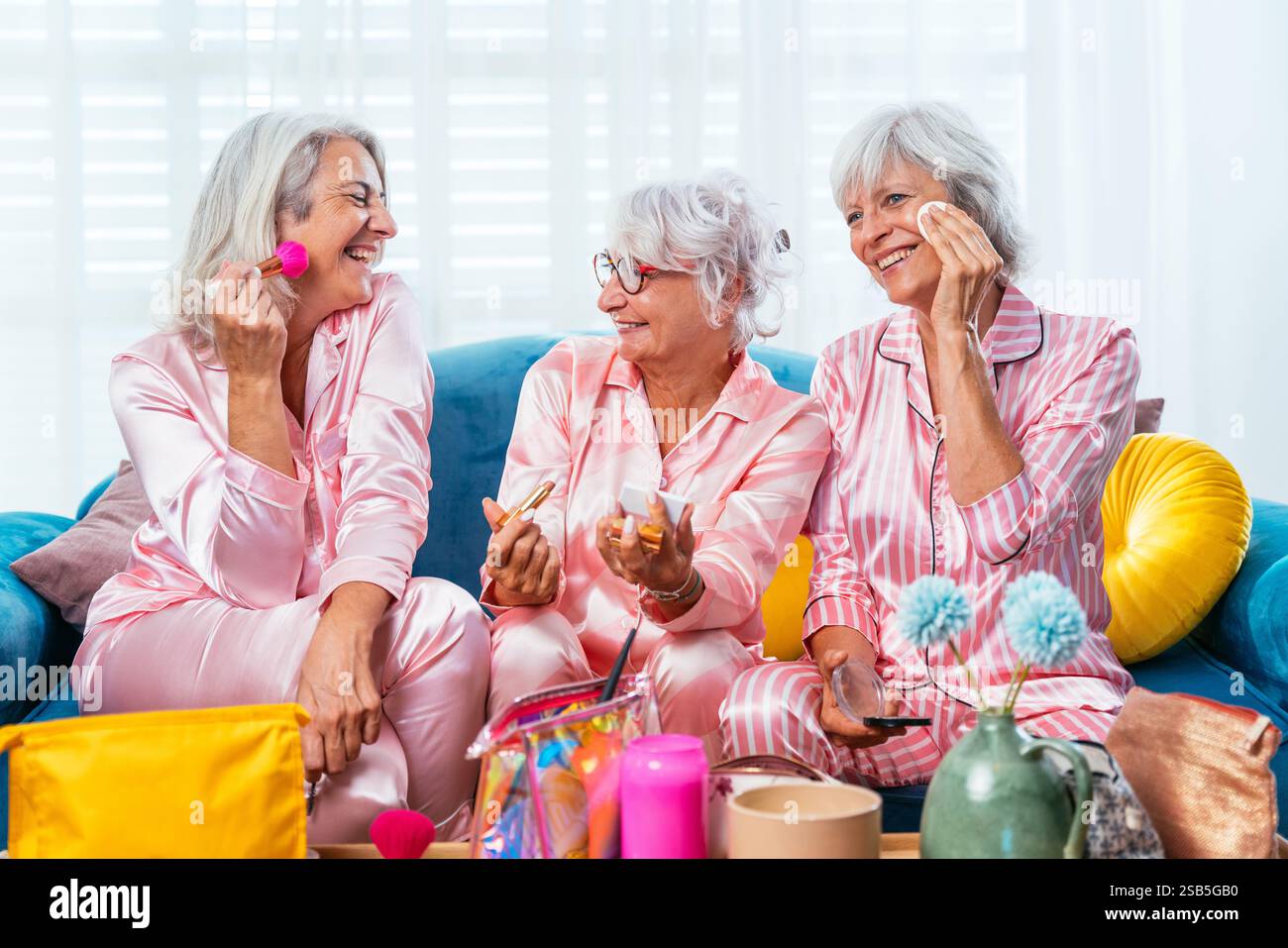 Beautiful senior women having funny pajama party at home - Group of ...