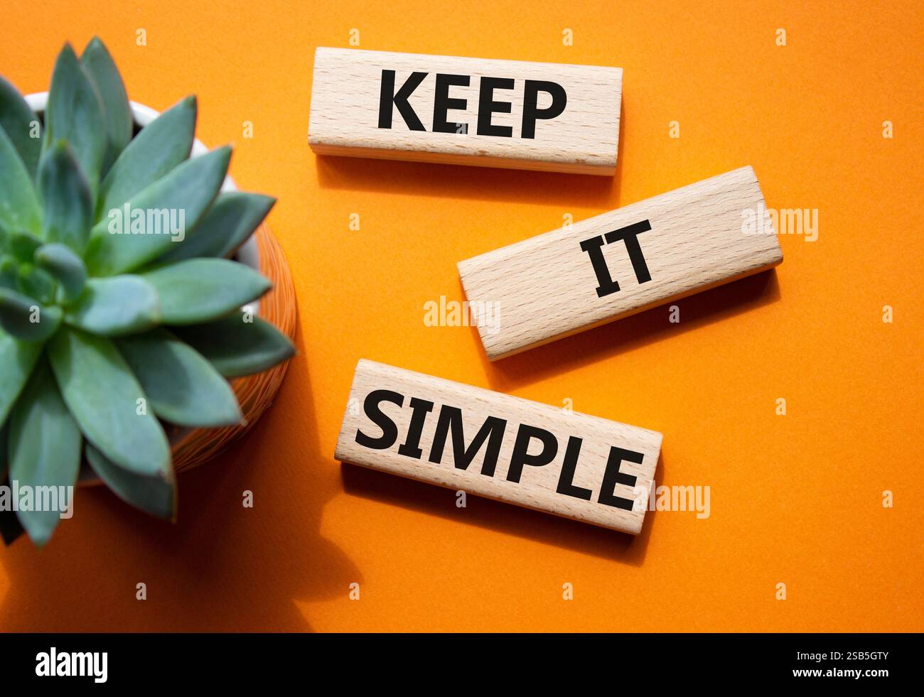 Keep it Simple symbol. Concept words Keep it Simple on wooden blocks ...