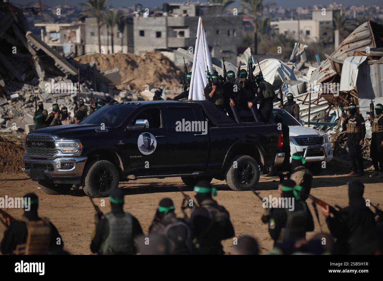 Palestinian militant group Hamas fighters escort Israeli-French hostage ...