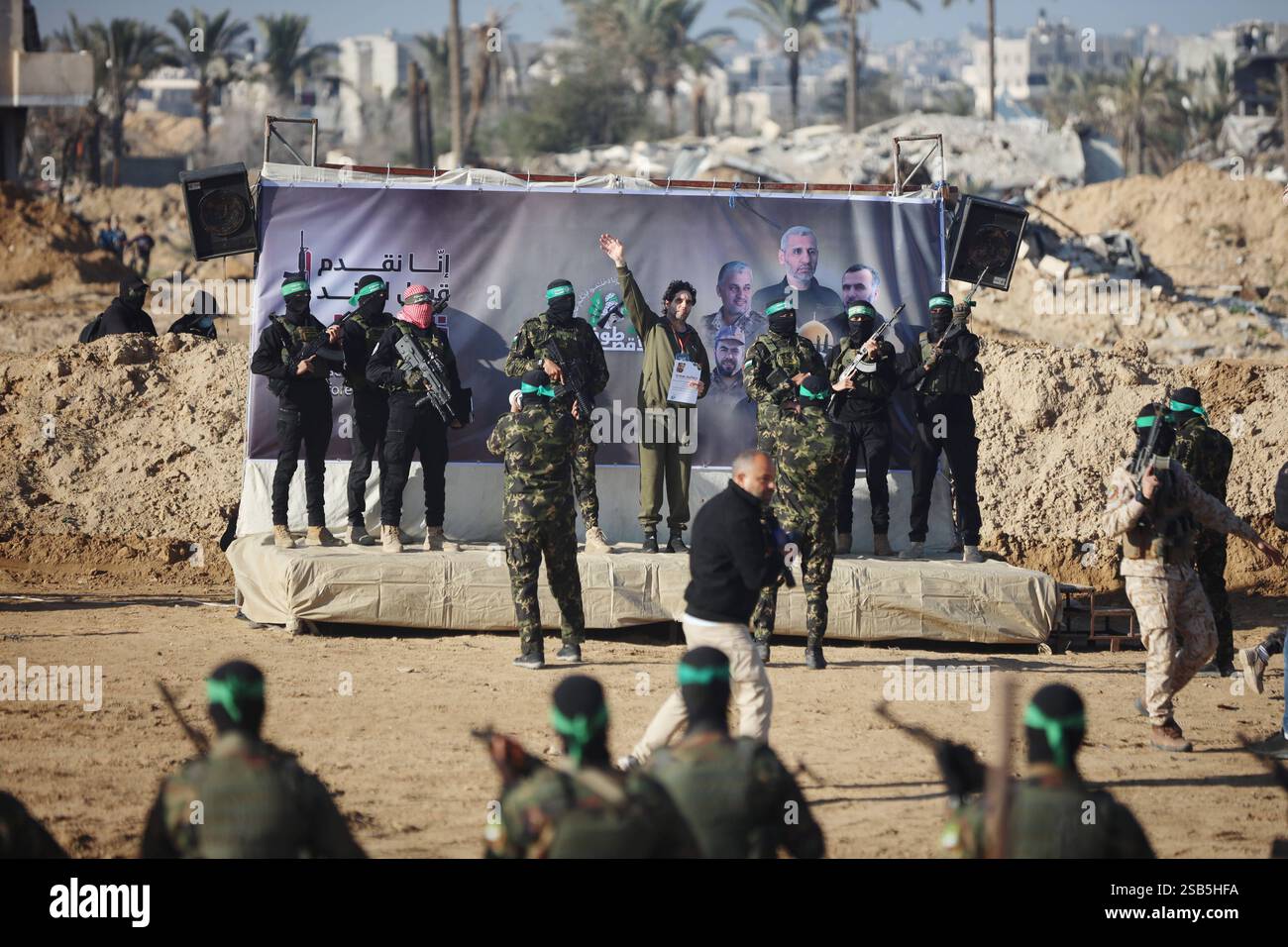 Palestinian militant group Hamas fighters escort Israeli-French hostage ...
