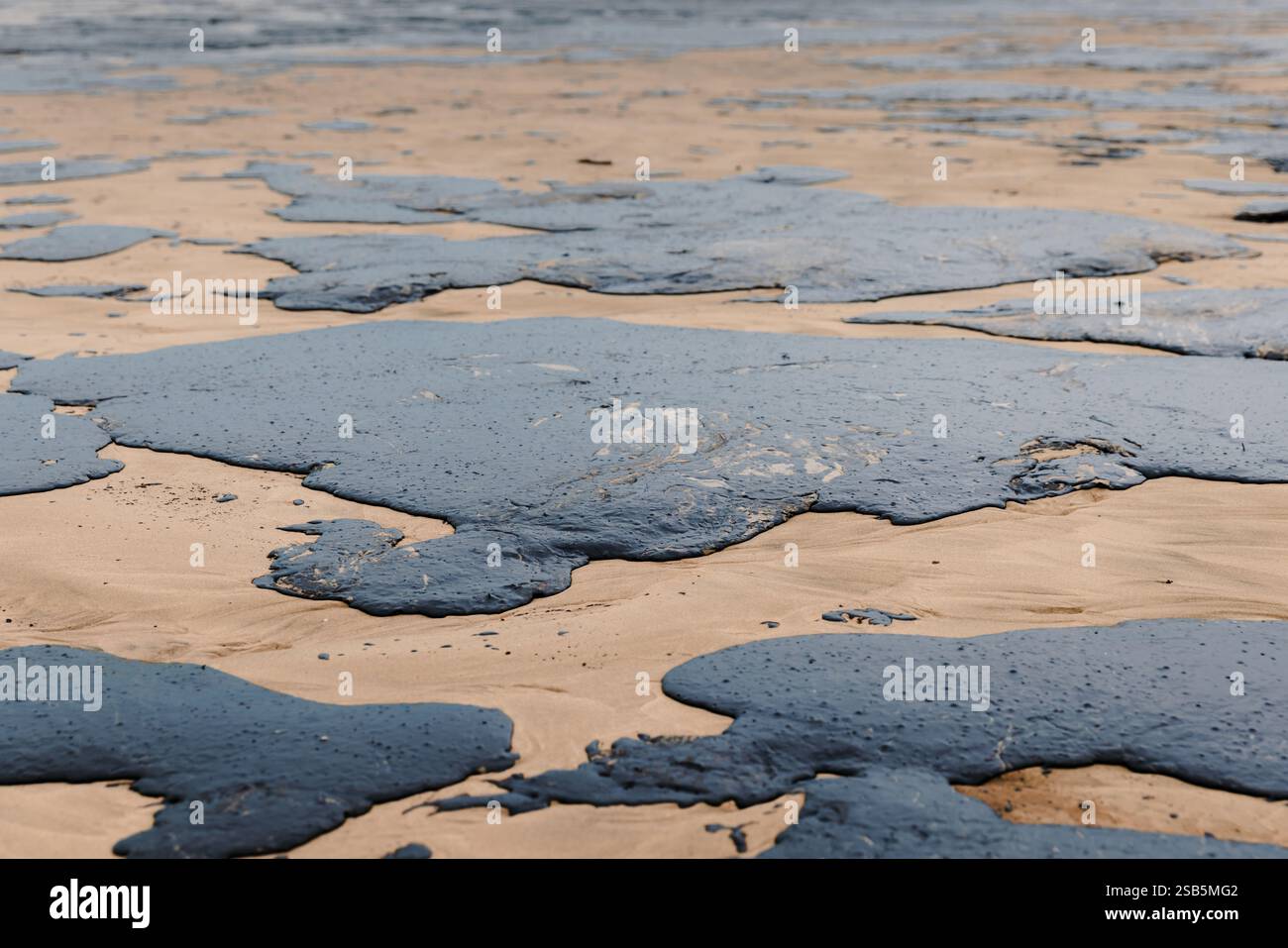 Oil spill in ocean coastline after a tanker wreck. Fuel oil leak and ...