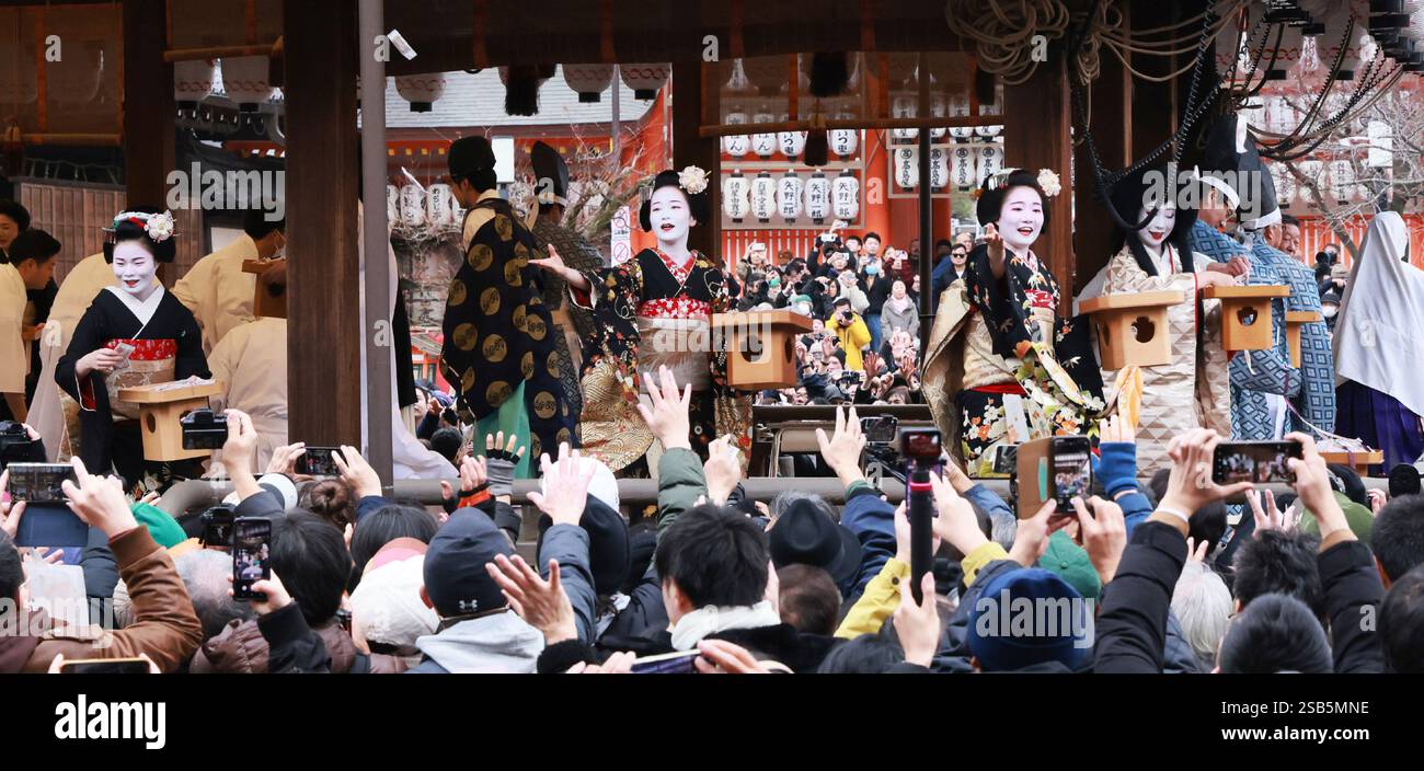 Geisha and maiko (apprentice) throw roasted beans during the Setsubun ...