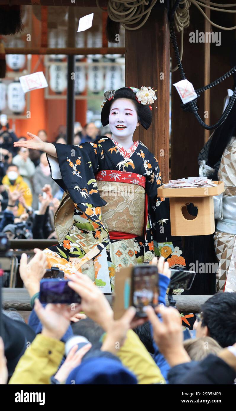 Geisha and maiko (apprentice) throw roasted beans during the Setsubun ...